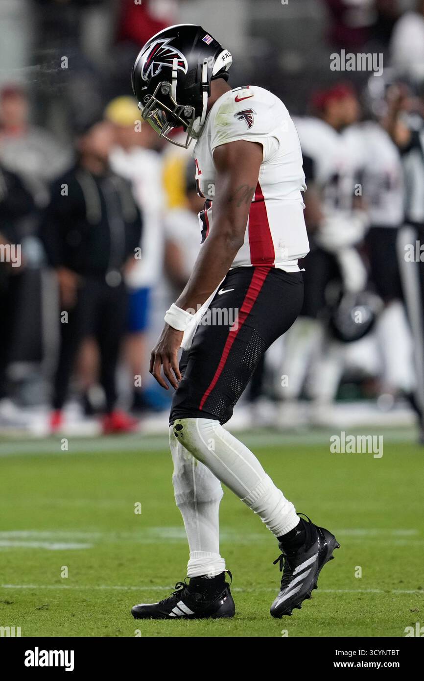 Atlanta Falcons quarterback Michael Penix Jr. (9) walks to huddle in ...