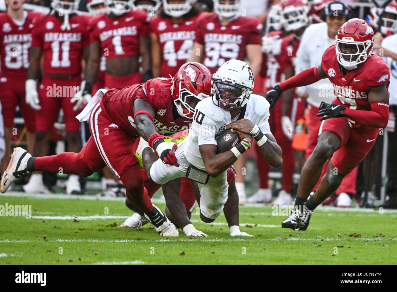 Texas A&M quarterback Marcel Reed (10) dives forward to pick up a few ...