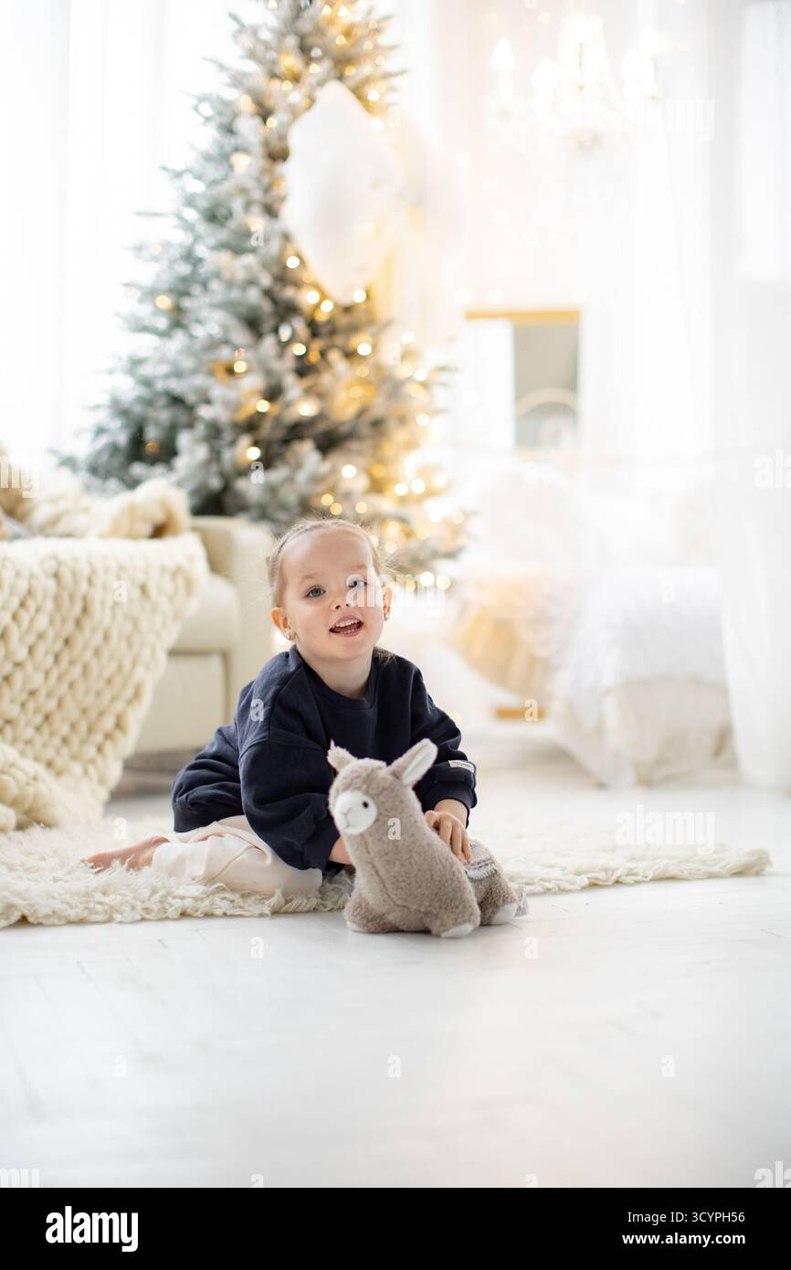 Child with Llama Toy at Christmas Stock Photo - Alamy