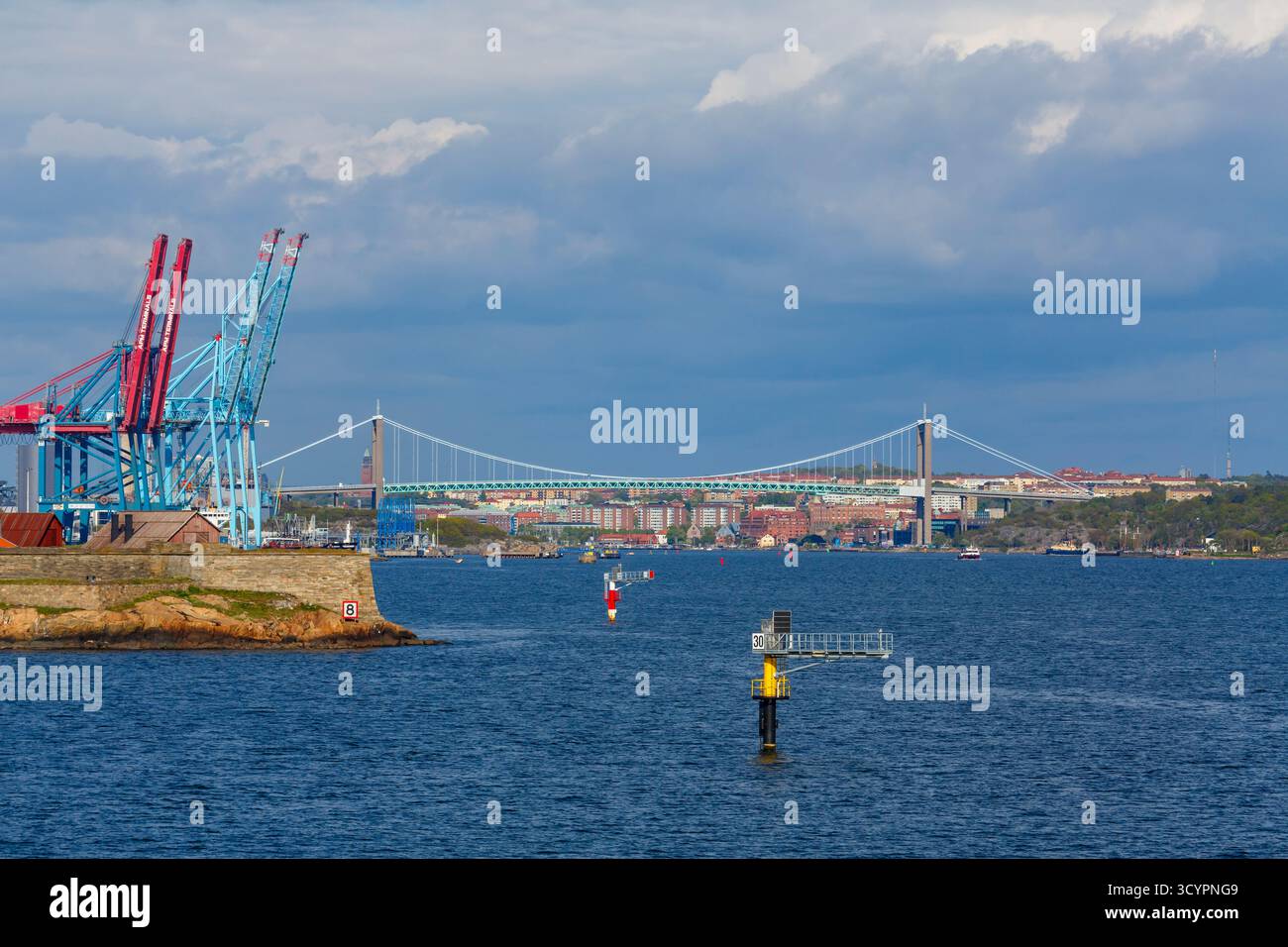 port of Gothenburg with loading cranes and Alvsborg Bridge in the ...