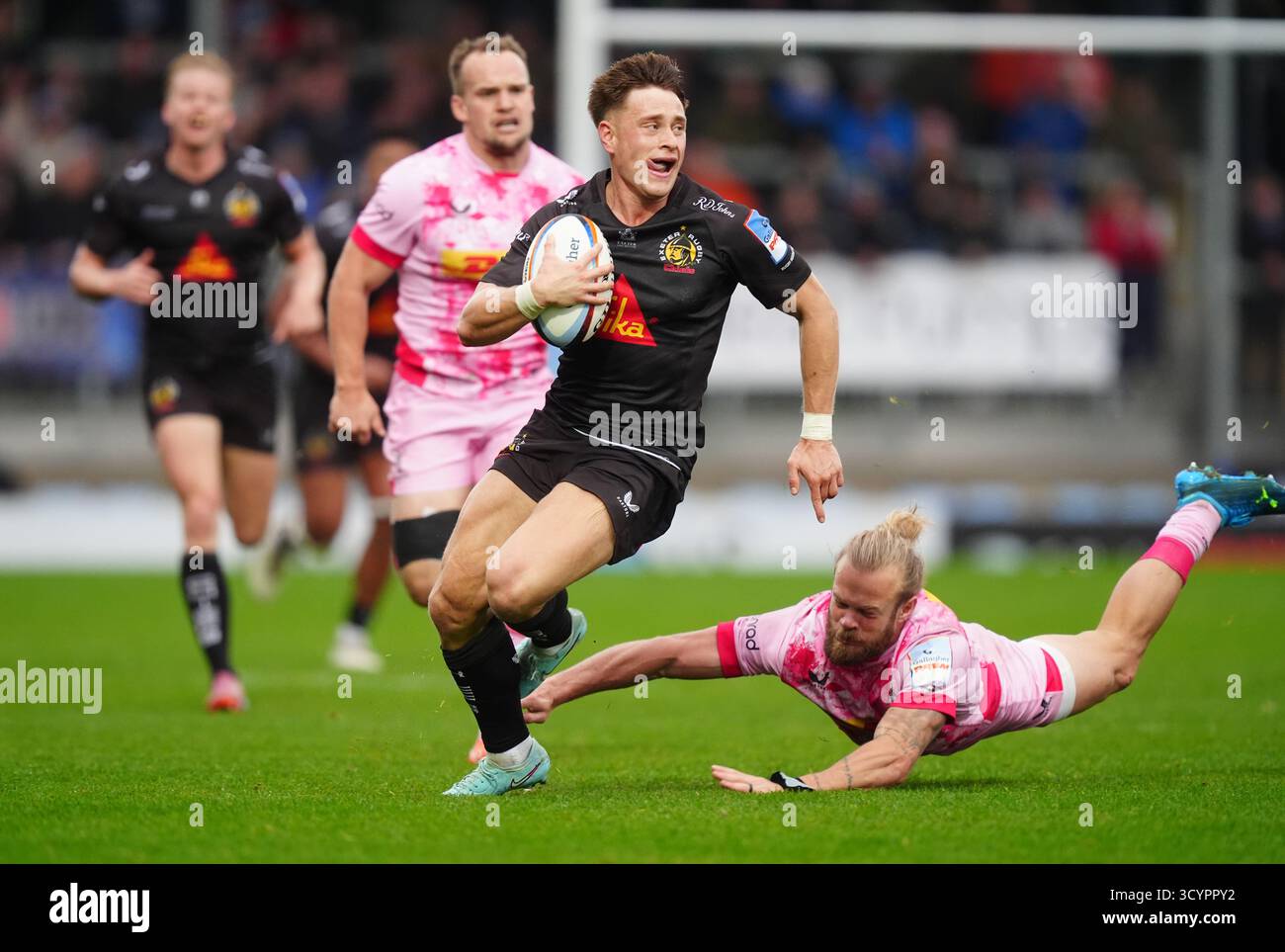 Exeter's Stephen Varney is tackled by Harlequins' Tyrone Green during ...
