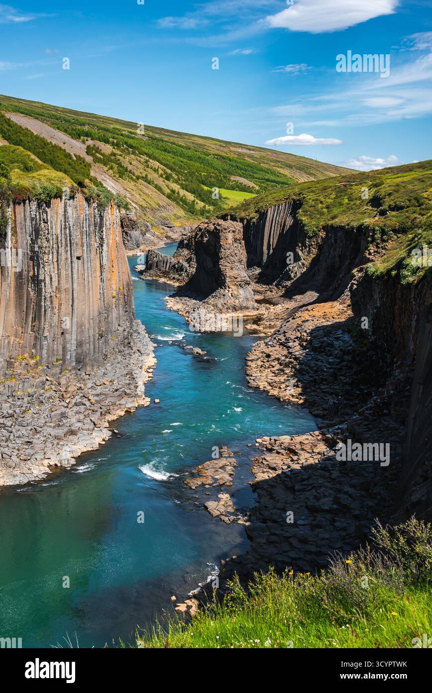 Studlagil Canyon basalt columns and blue river in East Iceland Stock ...
