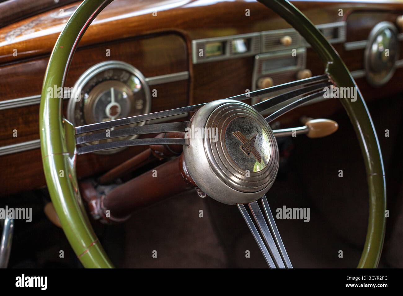Decorative classic car steering wheel and wooden dash Stock Photo - Alamy