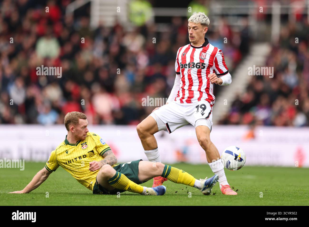 Stoke City’s Tomas Rigo and Wrexham’s Lewis O'Brien during the Sky Bet ...