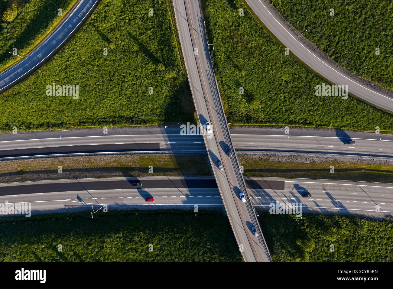 Overhead view intersecting highways with cars driving Stock Photo - Alamy