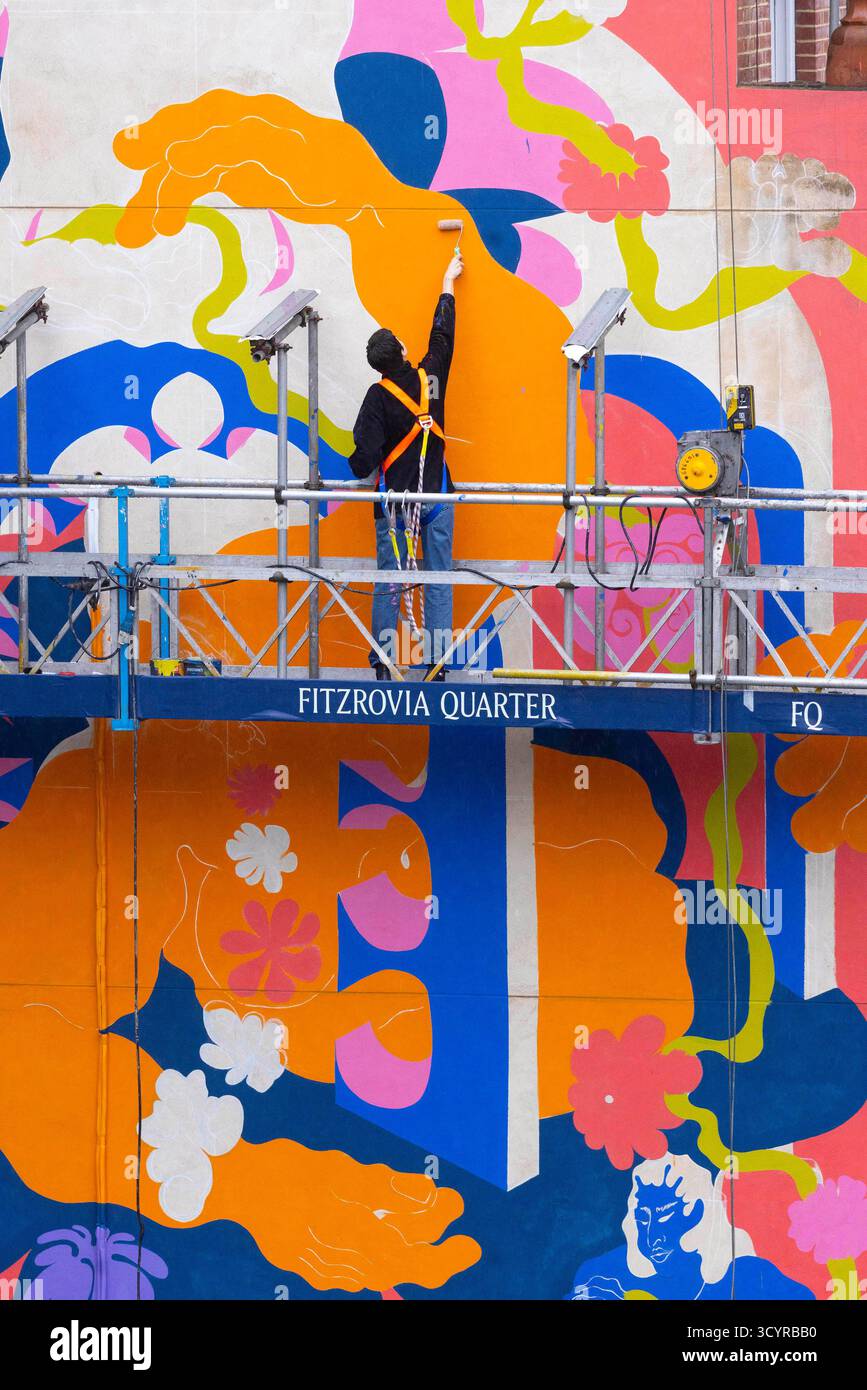 EDITORIAL USE ONLY Artist Oliwia Bober puts the finishing touches on ...