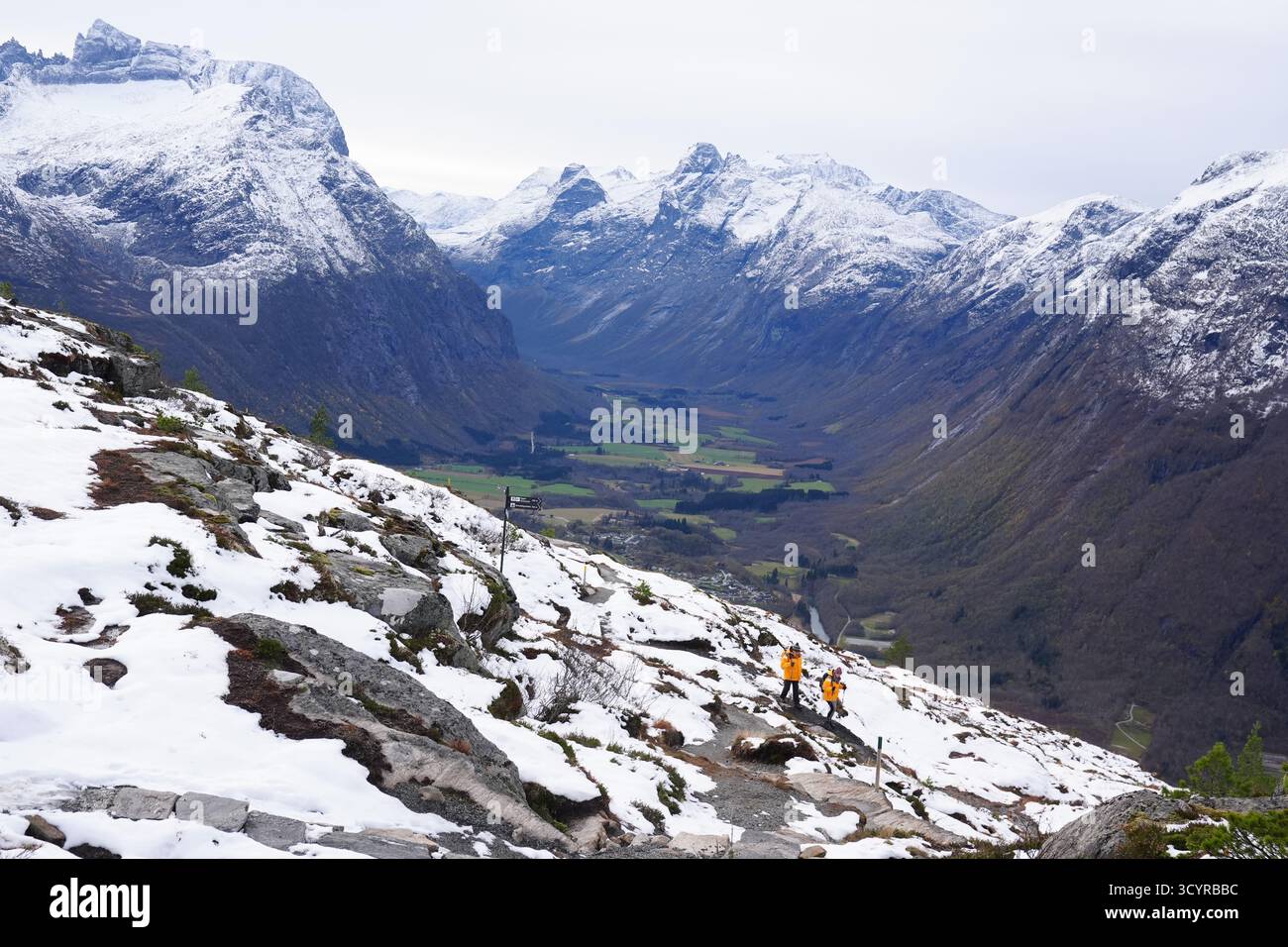A general view of people hiking through the snowy mountains in the ...