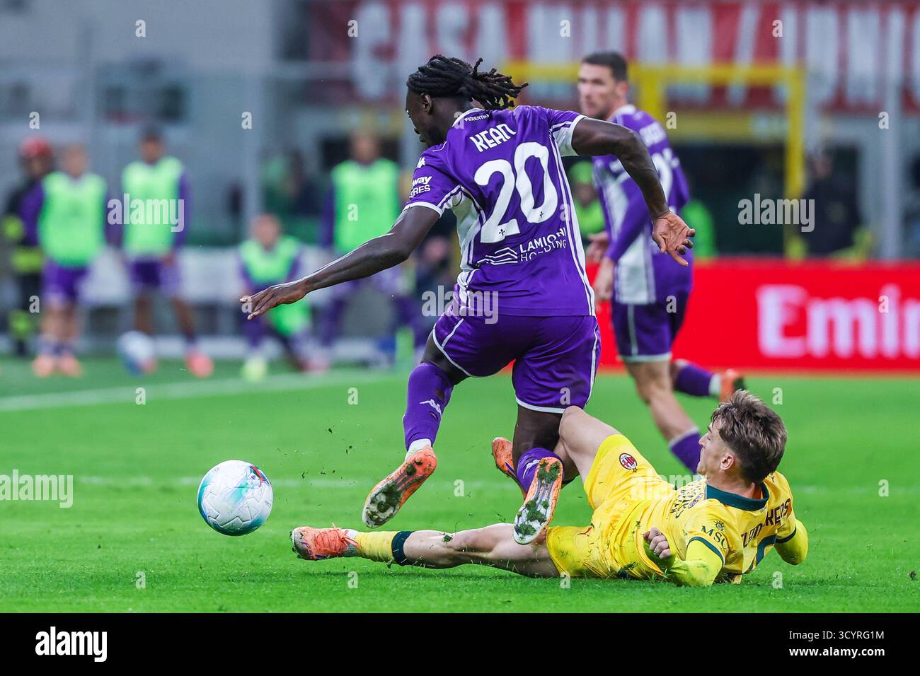 Moise Kean of ACF Fiorentina competes for the ball with Alexis ...