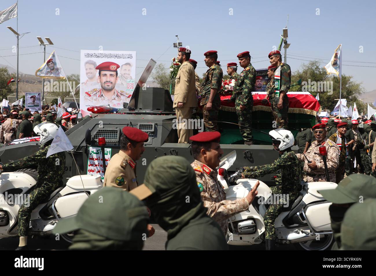 Houthi servicemen carry the coffin of Maj. Gen. Muhammad Abdul Karim al-Ghamari, who died after ...