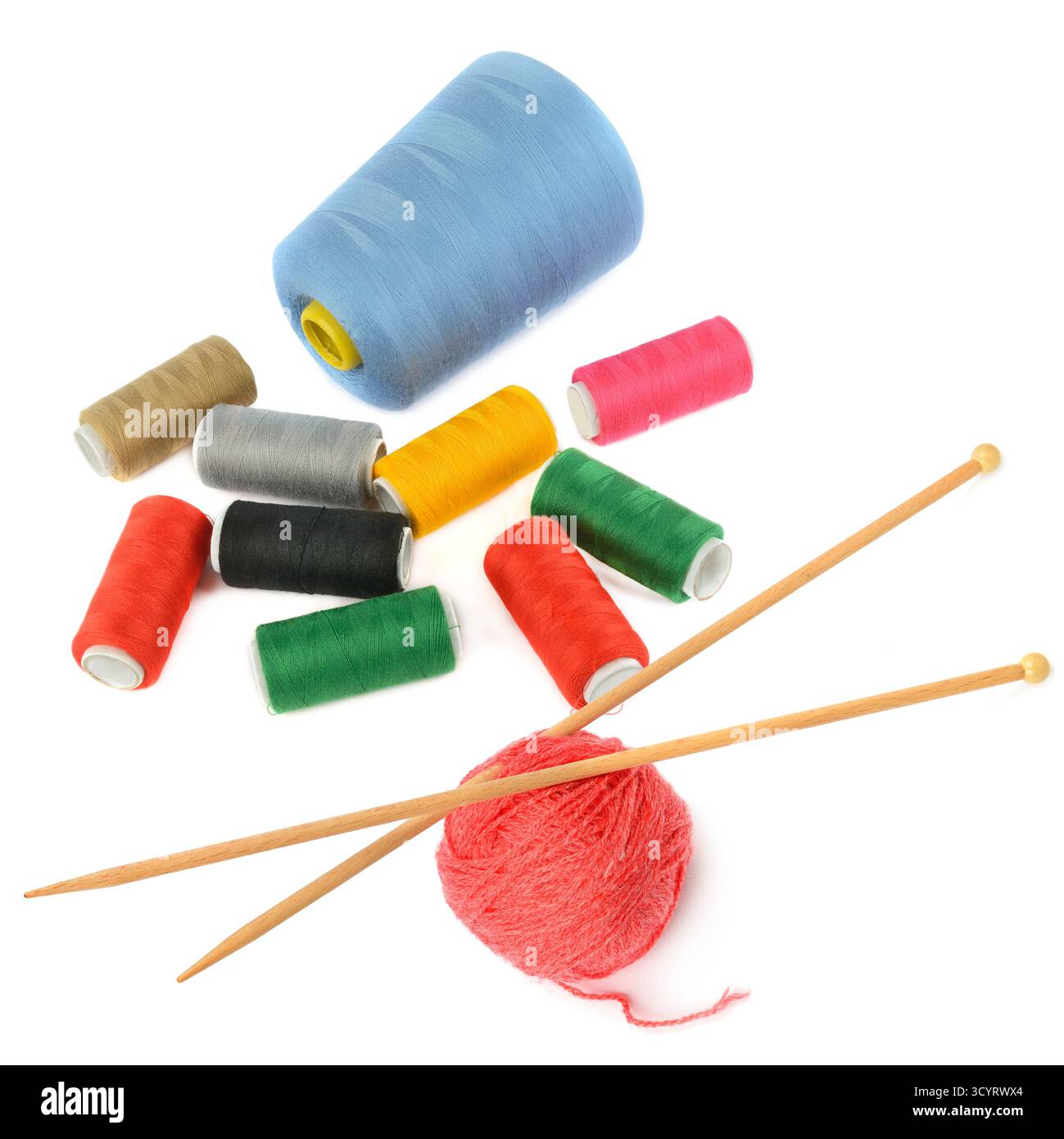 A flat lay of vibrant threads, a ball of red yarn, and wooden knitting ...
