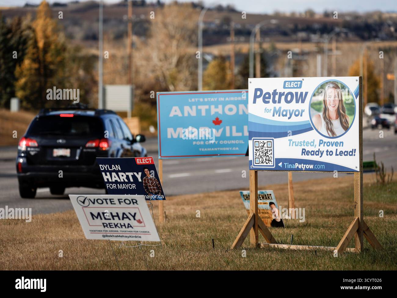 Campaign signs for Alberta municipal elections line a road in Airdrie ...