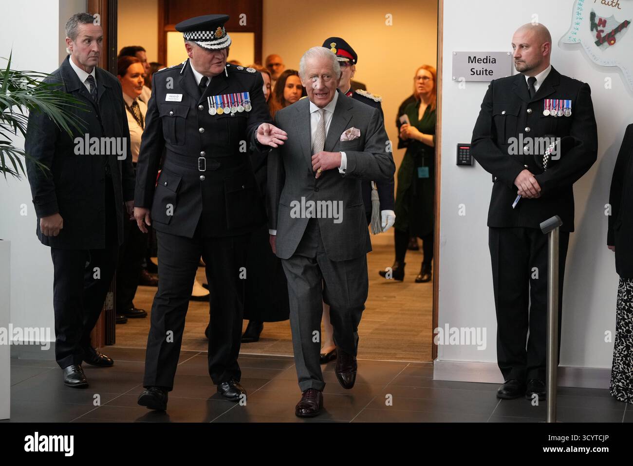 Britain's King Charles III is welcomed by Chief Constable Stephen Watson to meet emergency ...