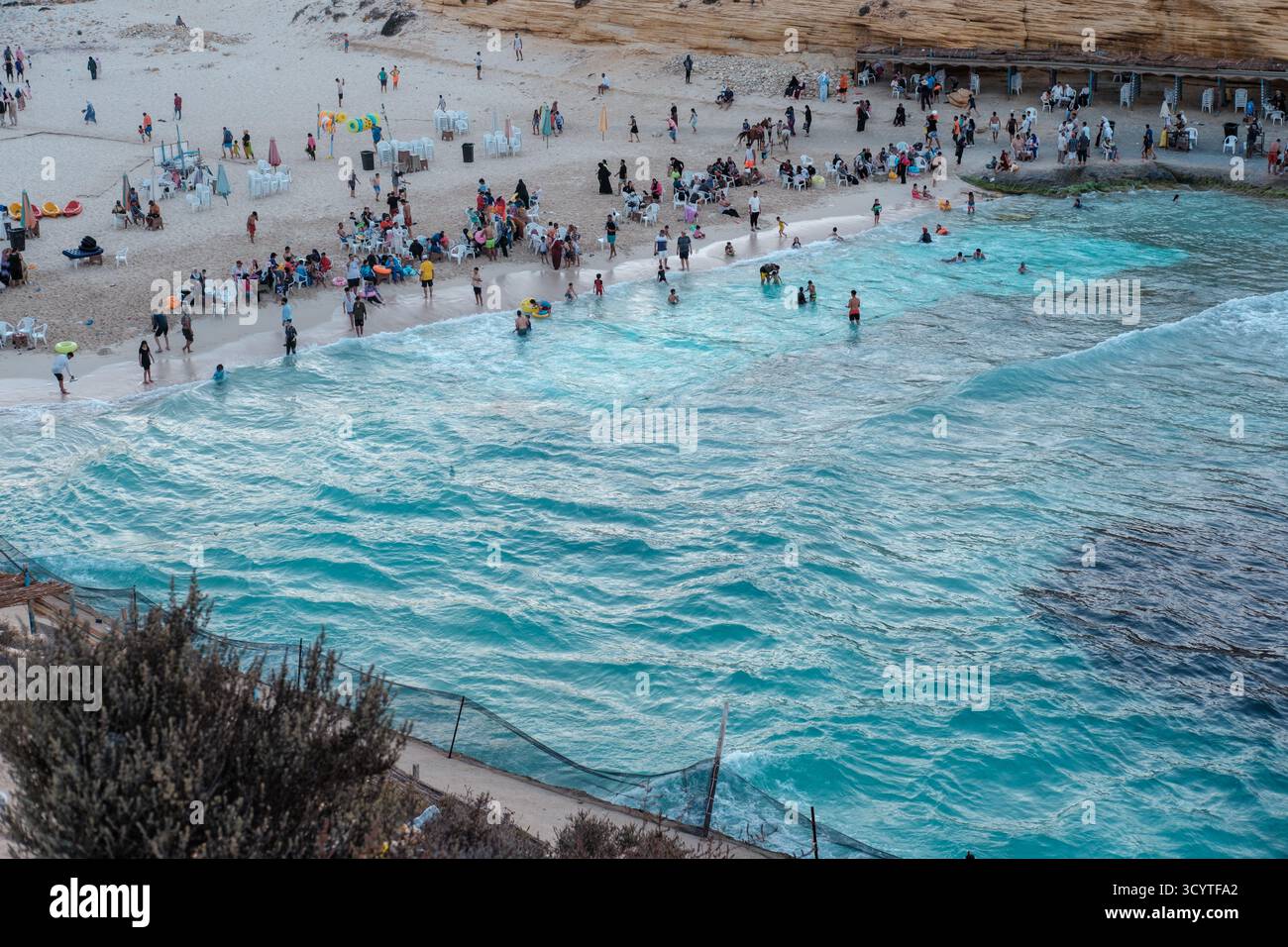 Summer beachgoers enjoy the famous Agiba 'miracle' beach cove near ...