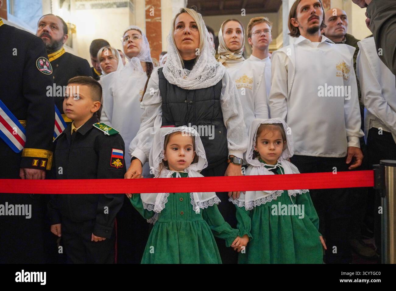 Believers and their children listen to Russian Orthodox Patriarch ...