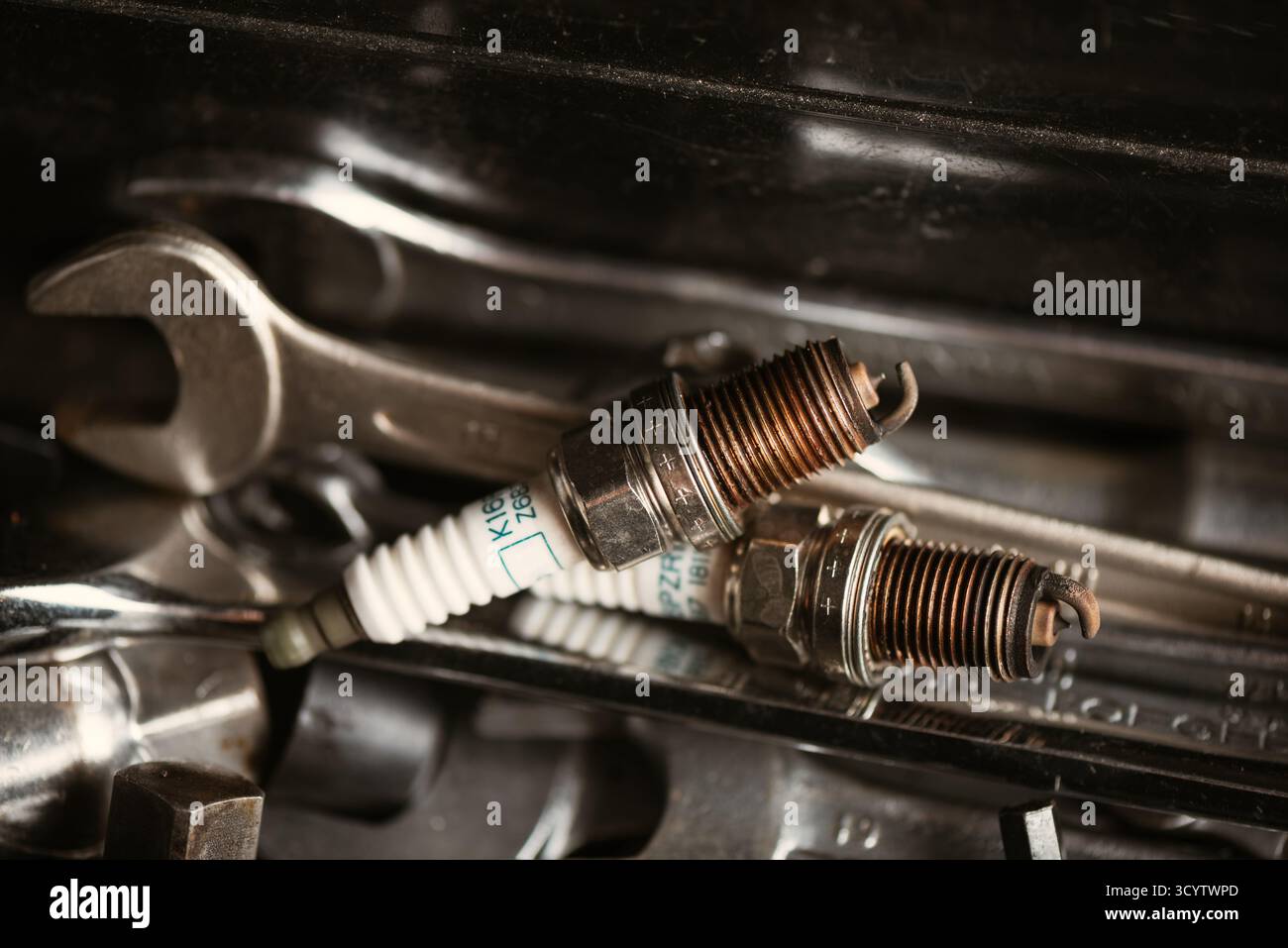 Spark plug replacement. Close up old spark plug, car maintenance ...