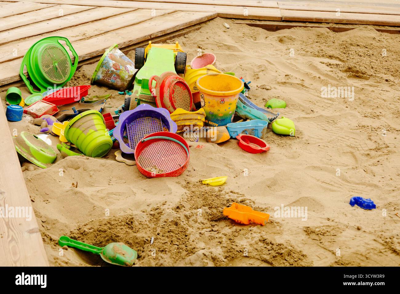 Colorful plastic toys in sandbox Stock Photo - Alamy
