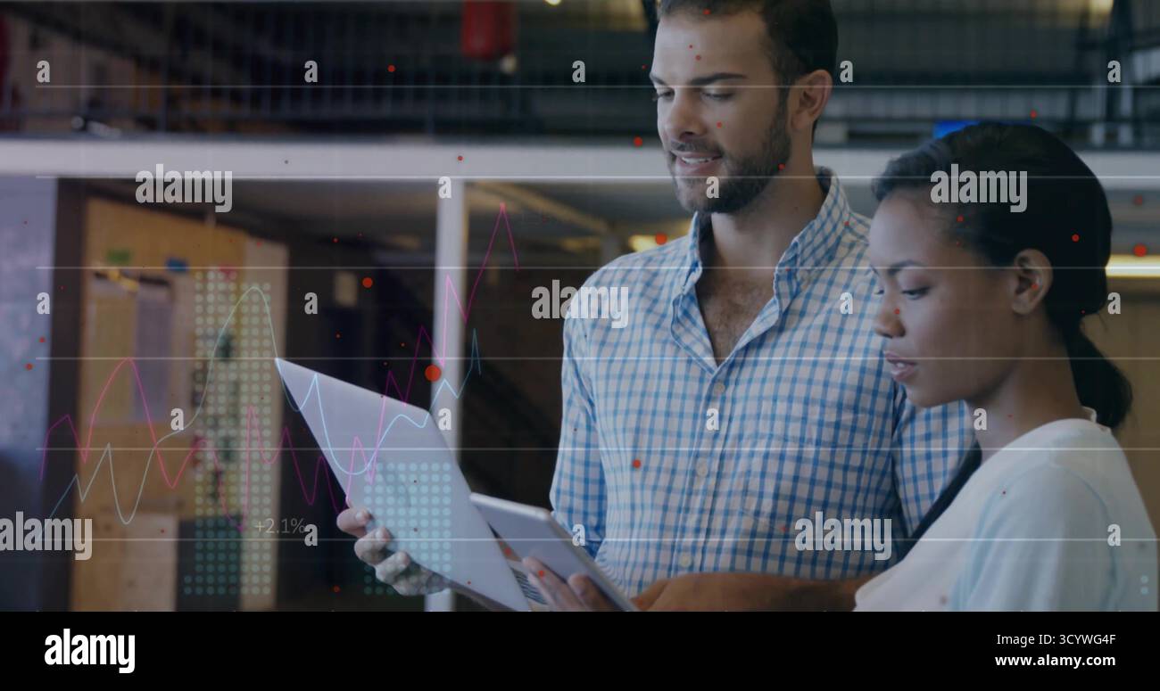 Collaborating coworkers analyzing line hi-res stock photography and ...