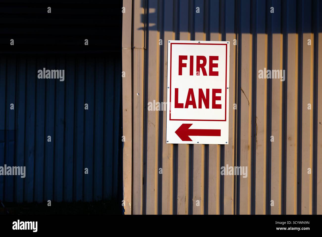 A red-and-white “Fire Lane” sign points the way in the early morning ...