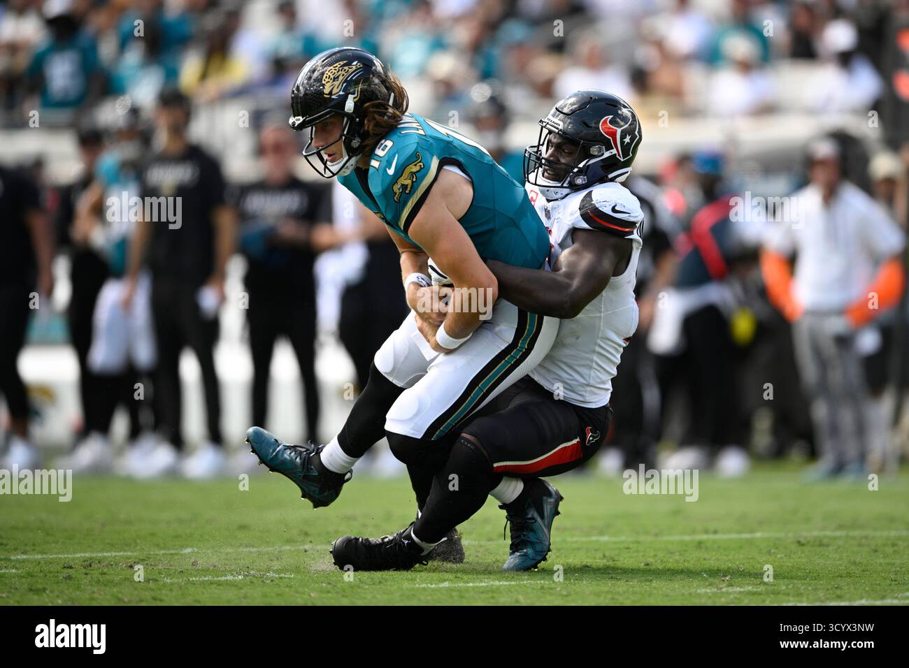 Houston Texans defensive end Will Anderson Jr., right, sacks ...