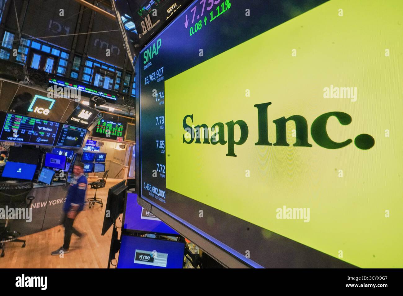 The logo for Snap Inc. is displayed above a trading post on the floor ...