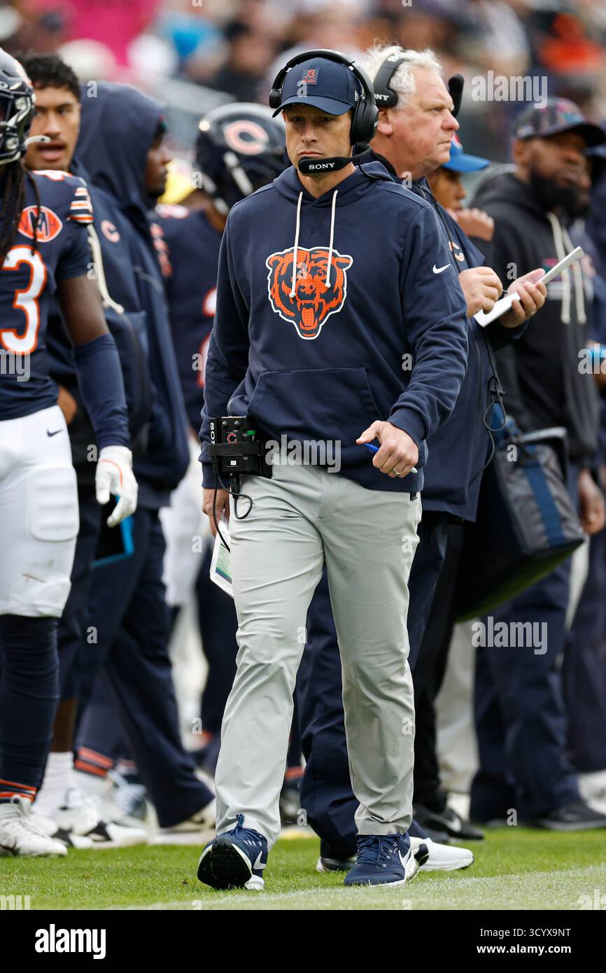 Chicago Bears head coach Ben Johnson walks on the sidelines wearing the ...