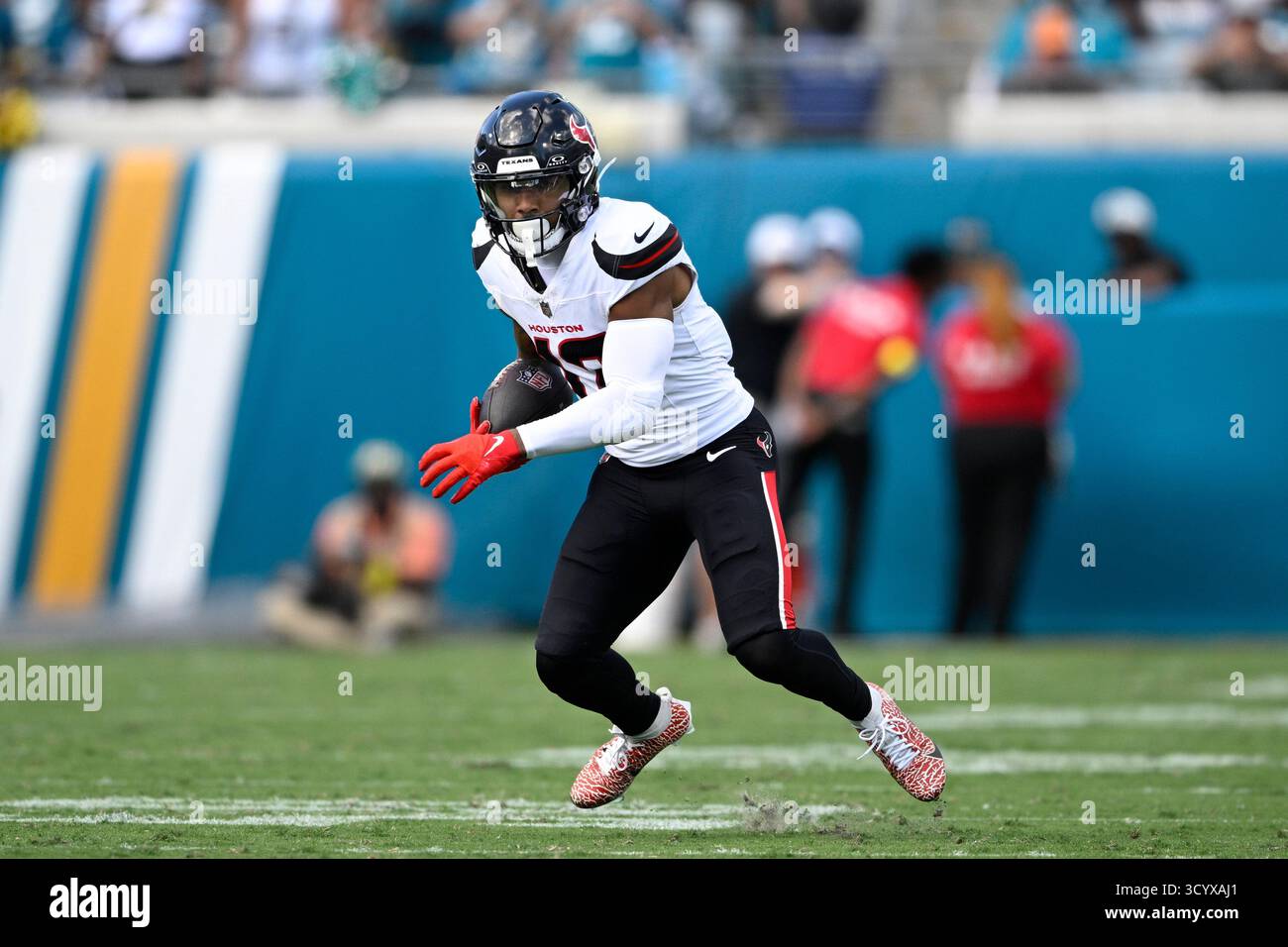 Houston Texans wide receiver Christian Kirk runs after catching a pass ...