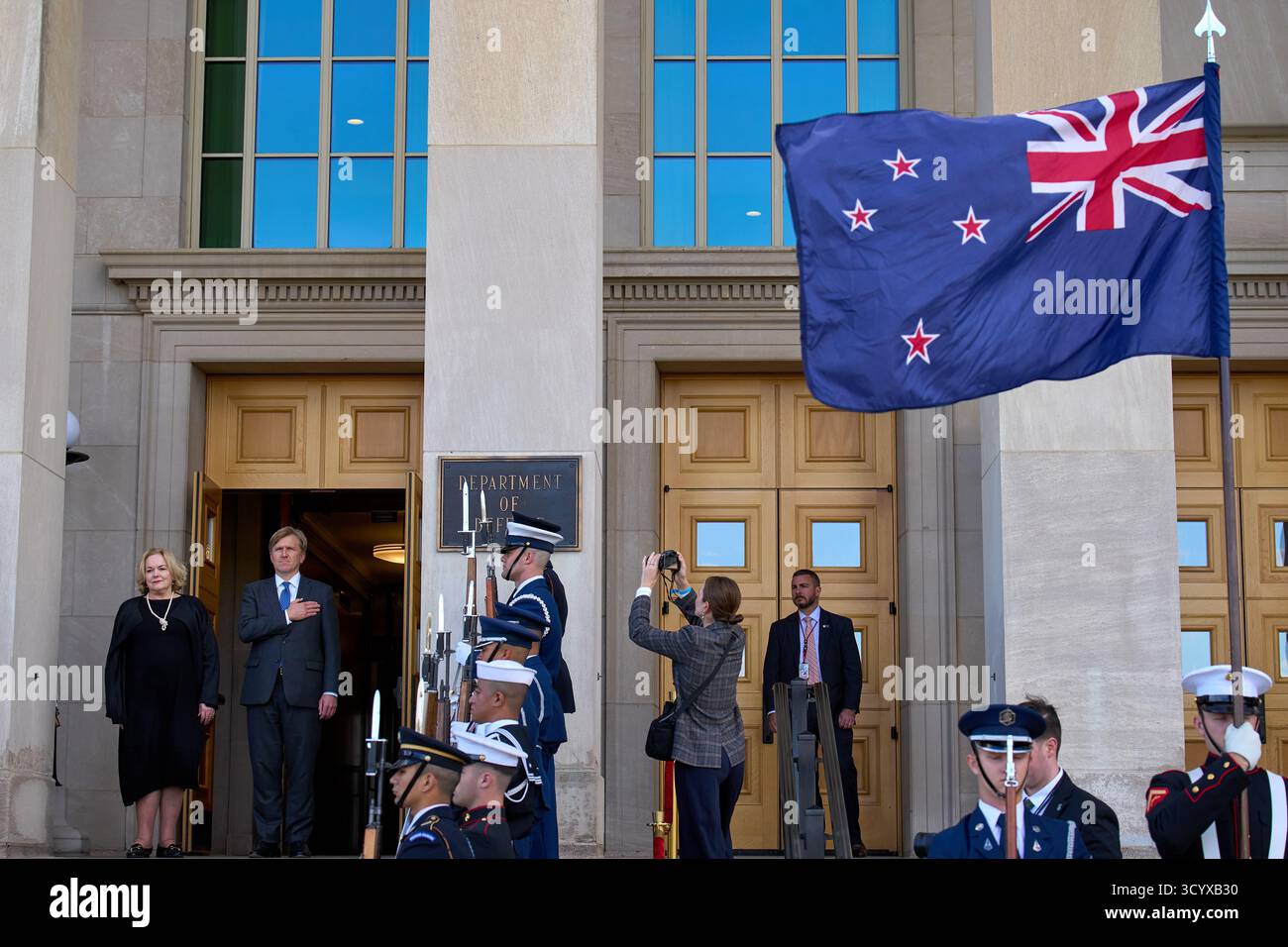 New Zealand's Defense Minister Judith Collins, left, stands next to ...