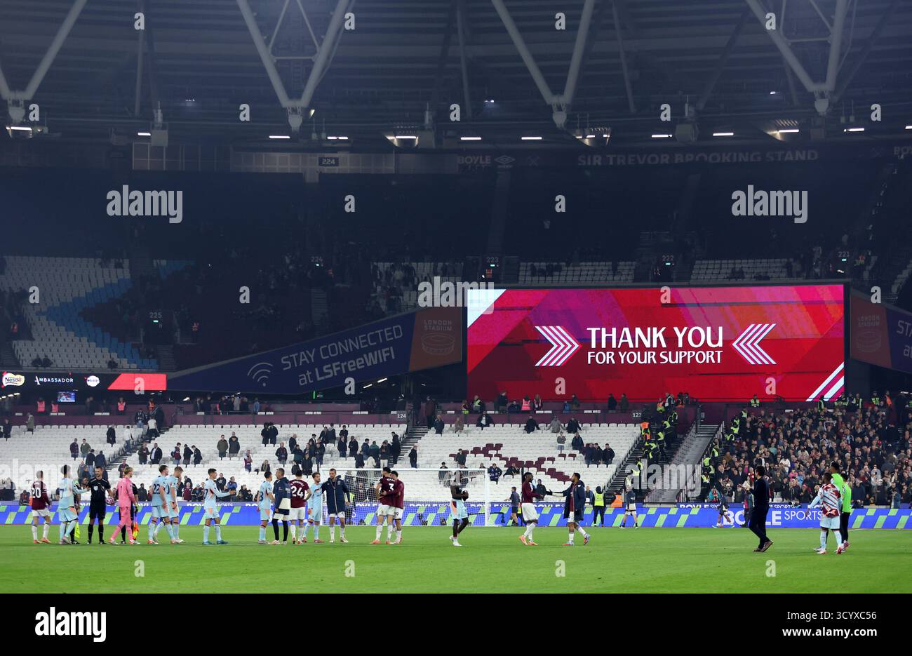 West Ham United and Brentford players shake hands as West Ham United ...