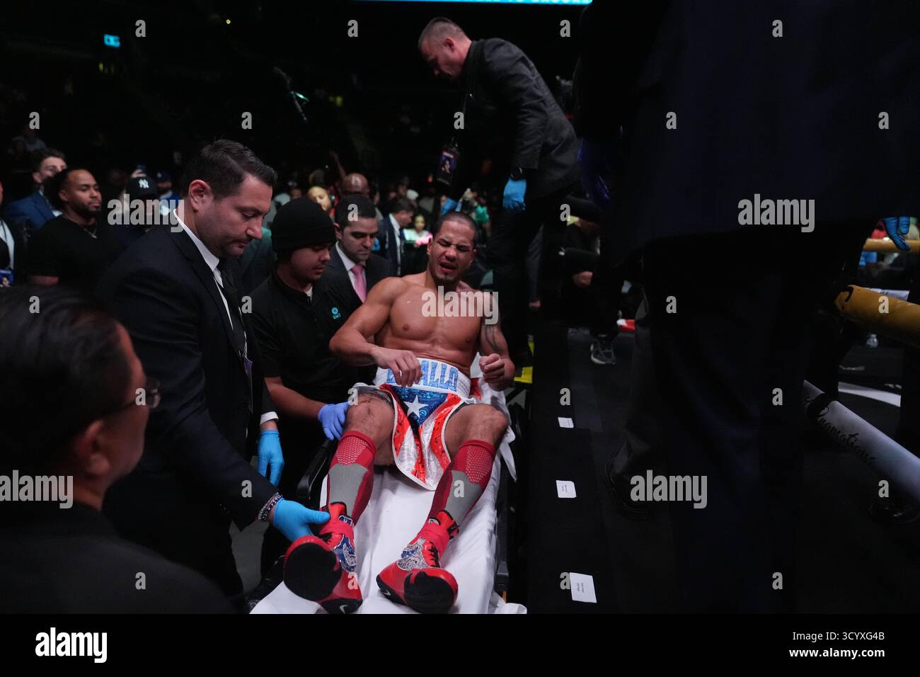 Daniel Gonzalez is carted away after a junior middleweight boxing match ...