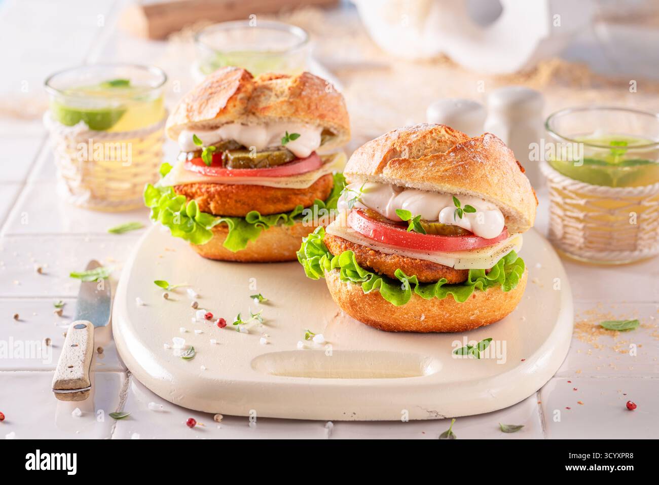 Healthy fish burger made of cheese, vegetables and mayonnaise ...