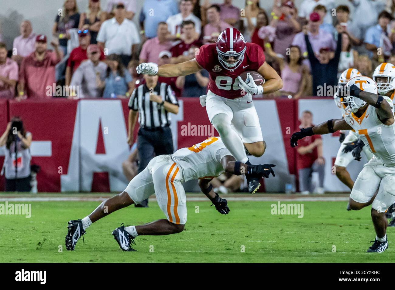 Alabama tight end Josh Cuevas (80) hurdles Tennessee linebacker Edwin ...