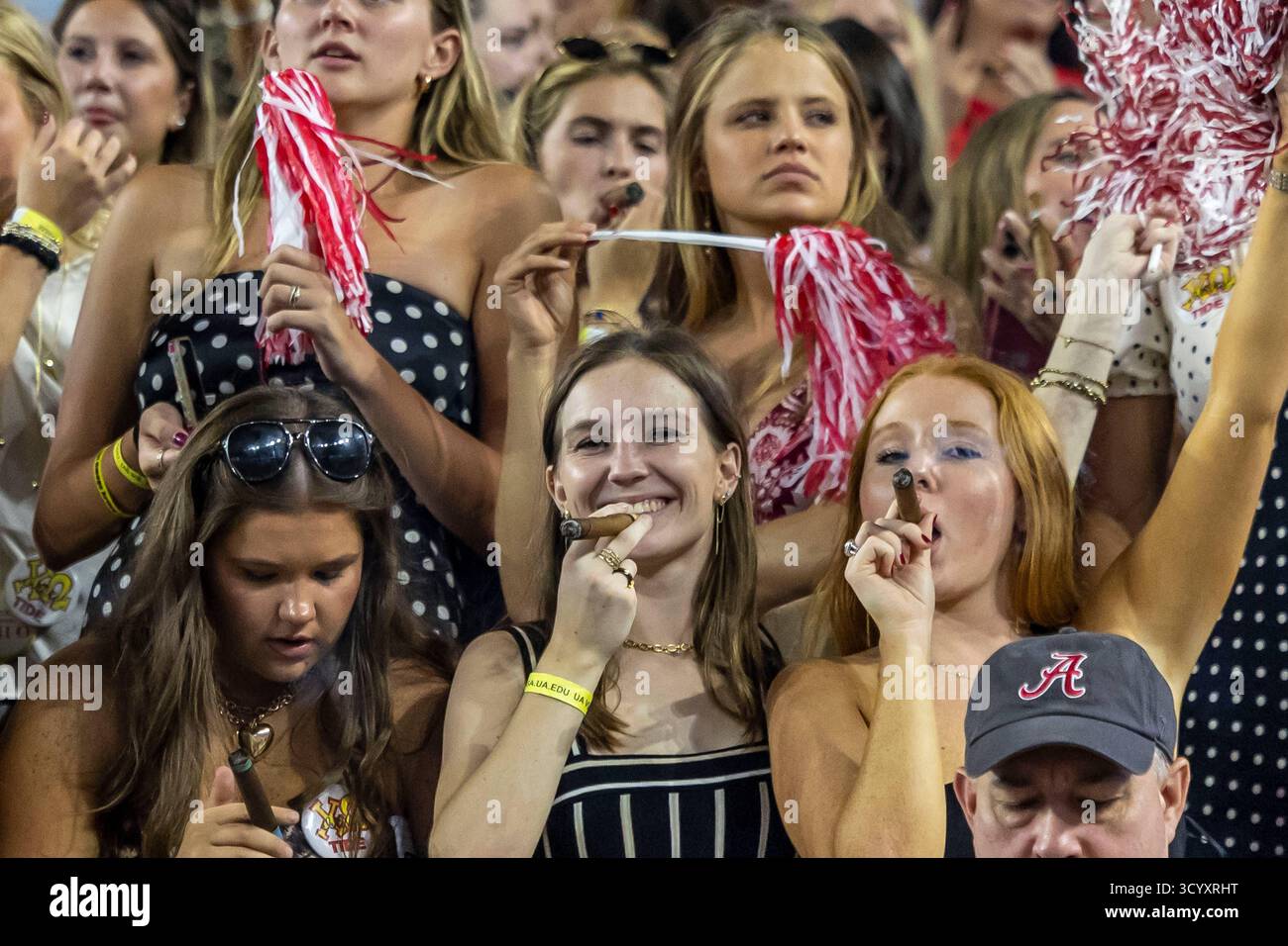Alabama fans enjoy victory cigars during the second half of an NCAA ...