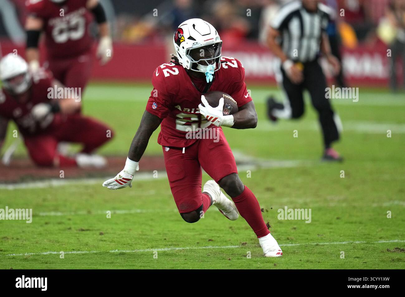 Arizona Cardinals running back Michael Carter (22) runs the ball ...