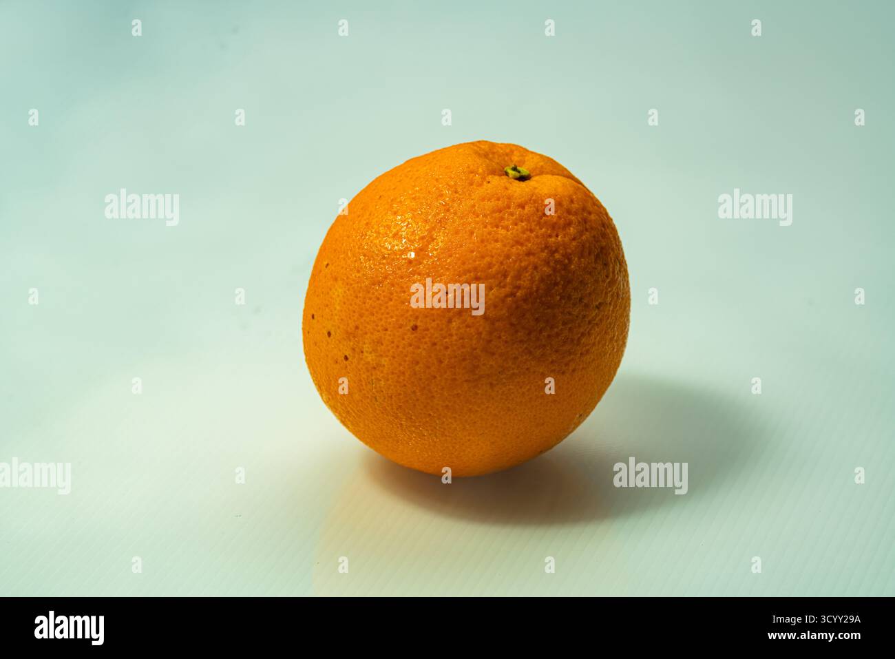 A fresh acid less orange surrounded by a thin mist, capturing the calm ...