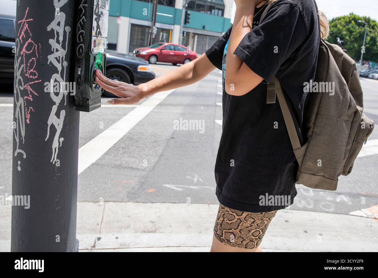 Person pressing a pedestrian crossing button, also known as a crosswalk ...