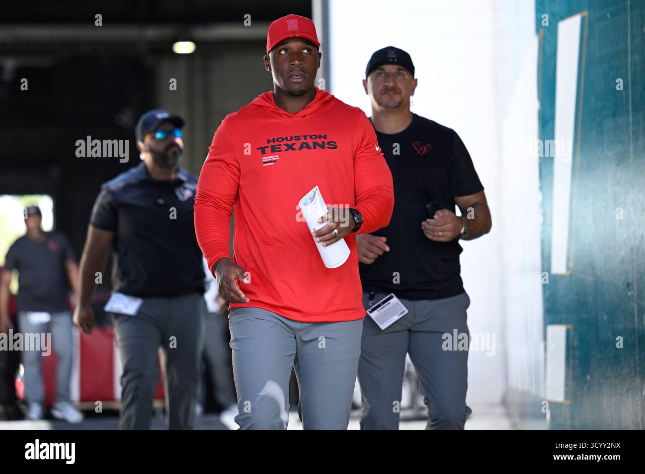 Houston Texans head coach DeMeco Ryans, front, heads to the field ...