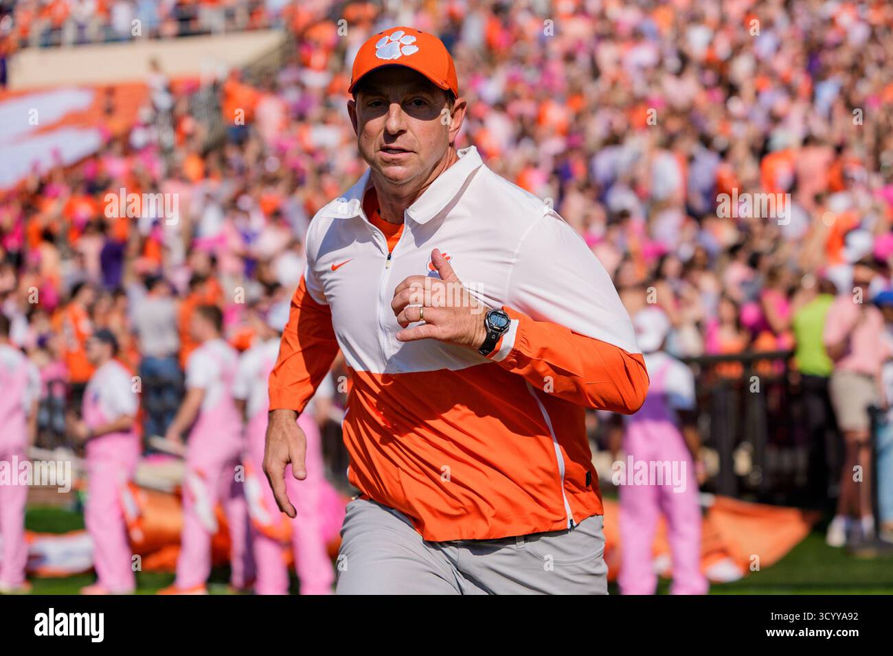 Clemson head coach Dabo Swinney runs onto the field during an NCAA ...