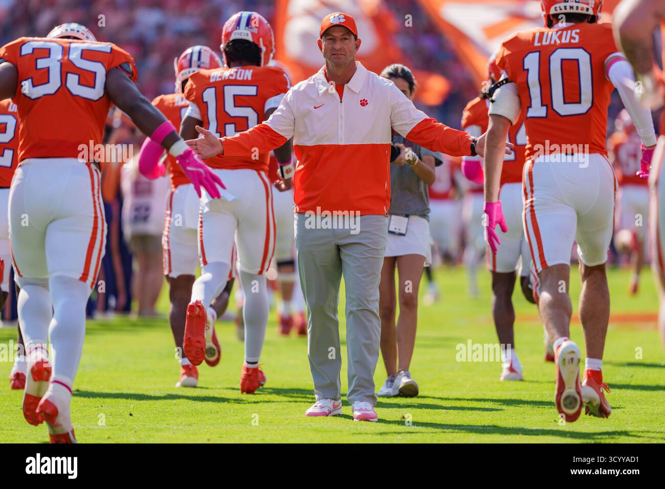 Clemson head coach Dabo Swinney greets players during an NCAA college ...