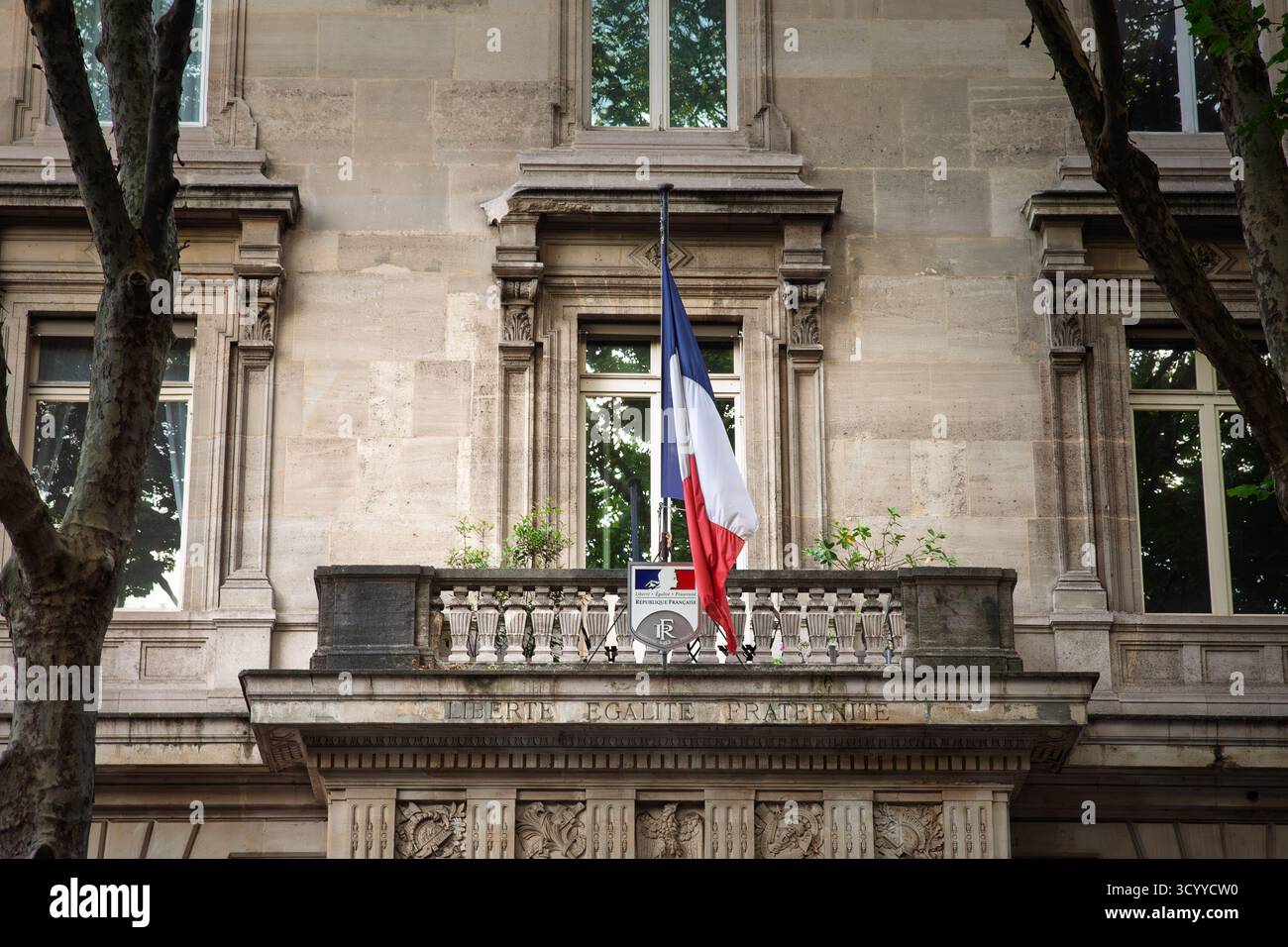 PARIS, FRANCE - JUNE 22, 2025: French tricolor flag above the RF ...