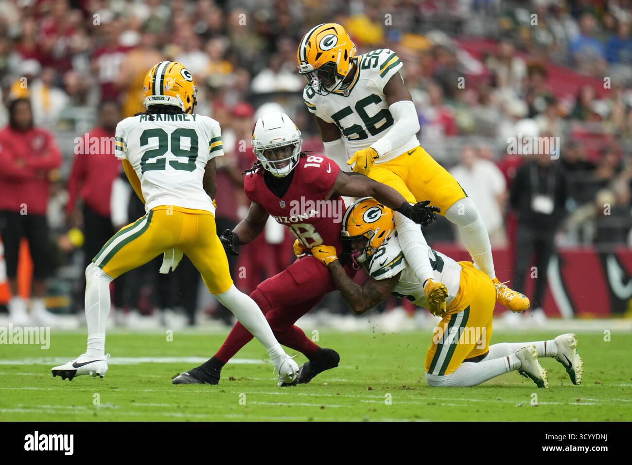 Arizona Cardinals wide receiver Marvin Harrison Jr. (18) gets hit by ...