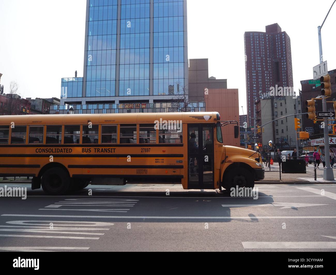 Public yellow bus crossing downtown hi-res stock photography and images ...