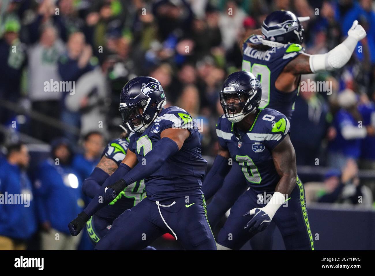 Seattle Seahawks linebacker Uchenna Nwosu, left, and DeMarcus Lawrence ...