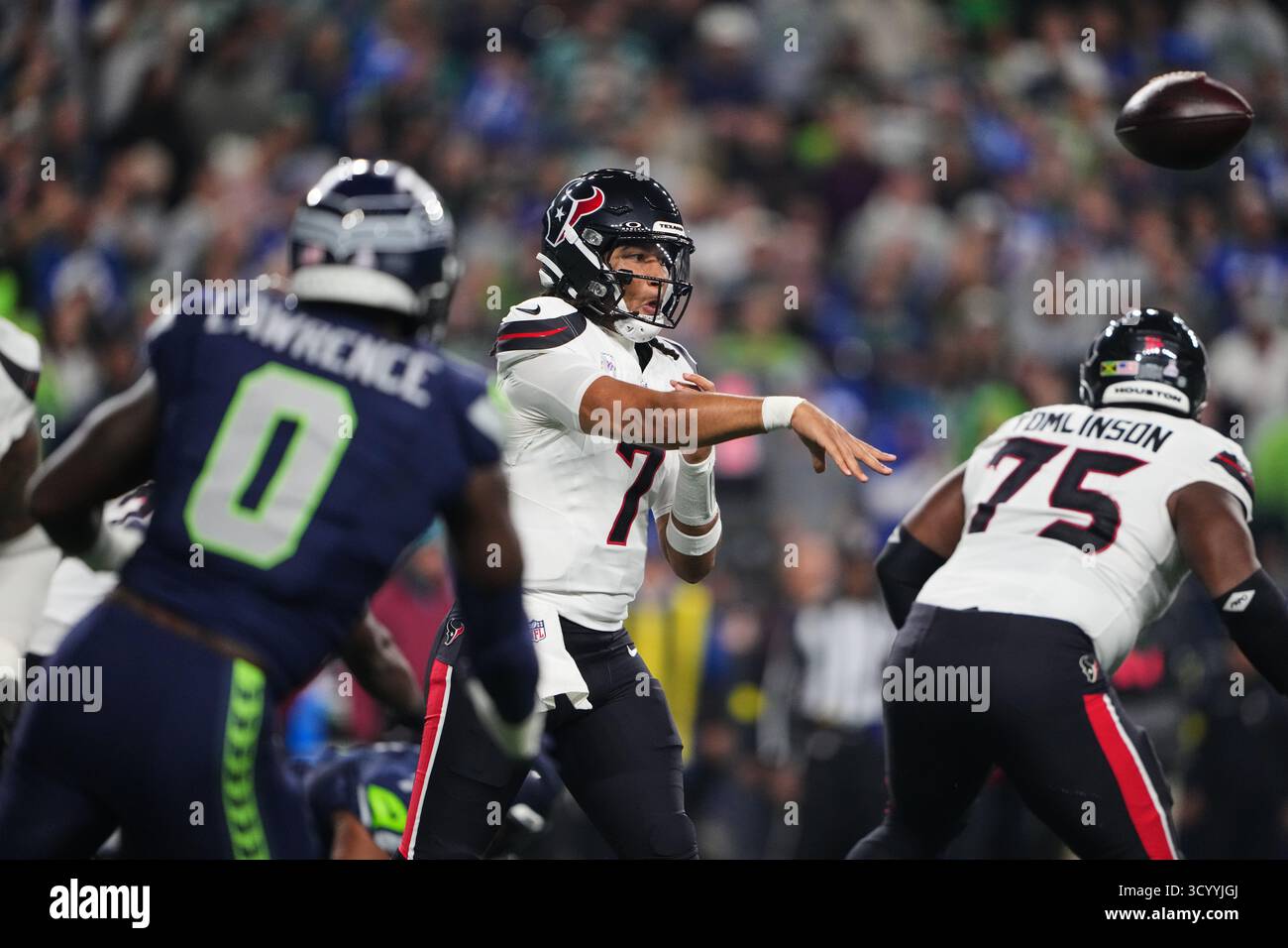 Houston Texans quarterback C.J. Stroud (7) throws a pass under pressure ...