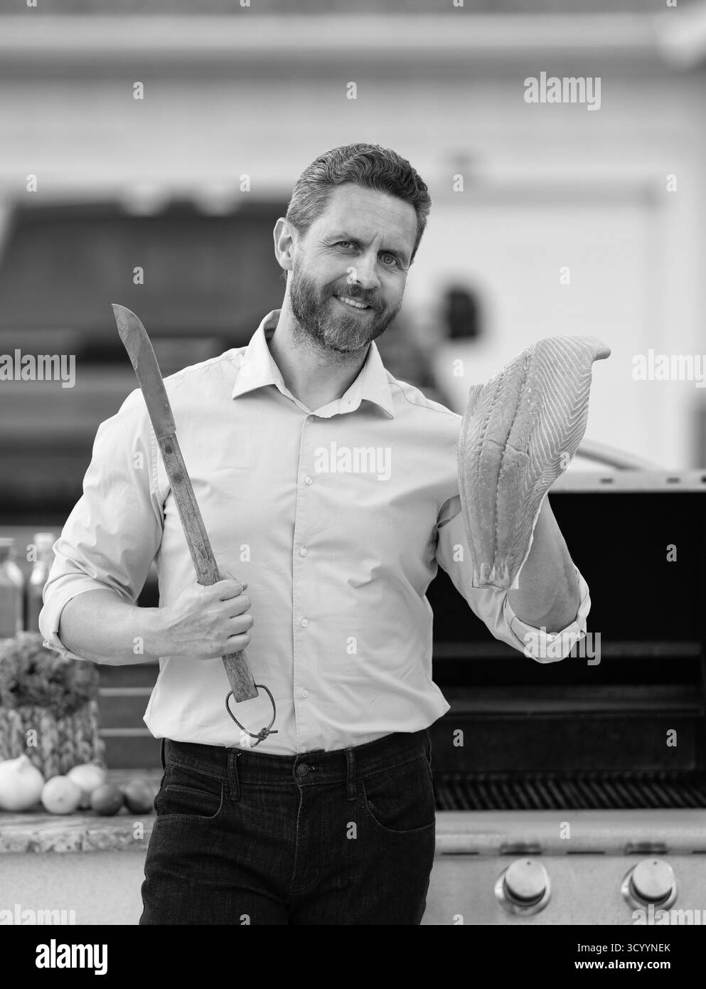 Chef grilling fresh seafood Black and White Stock Photos & Images - Alamy