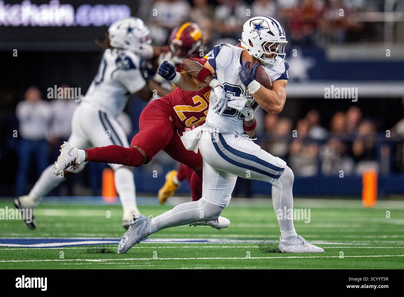 Dallas Cowboys tight end Jake Ferguson is brought down by Washington ...