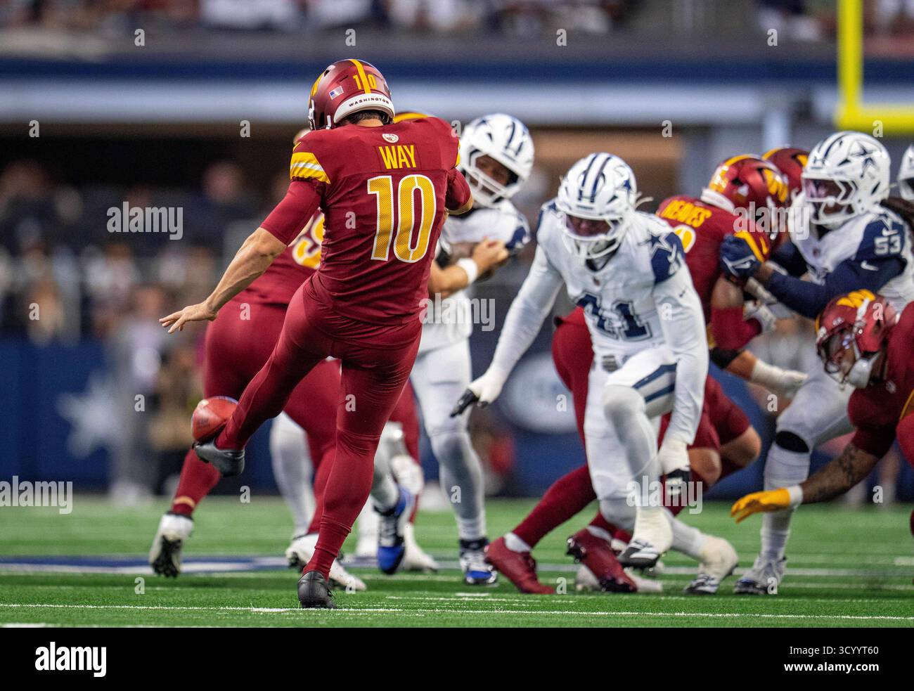 Washington Commanders punter Tress Way punts during a football game ...