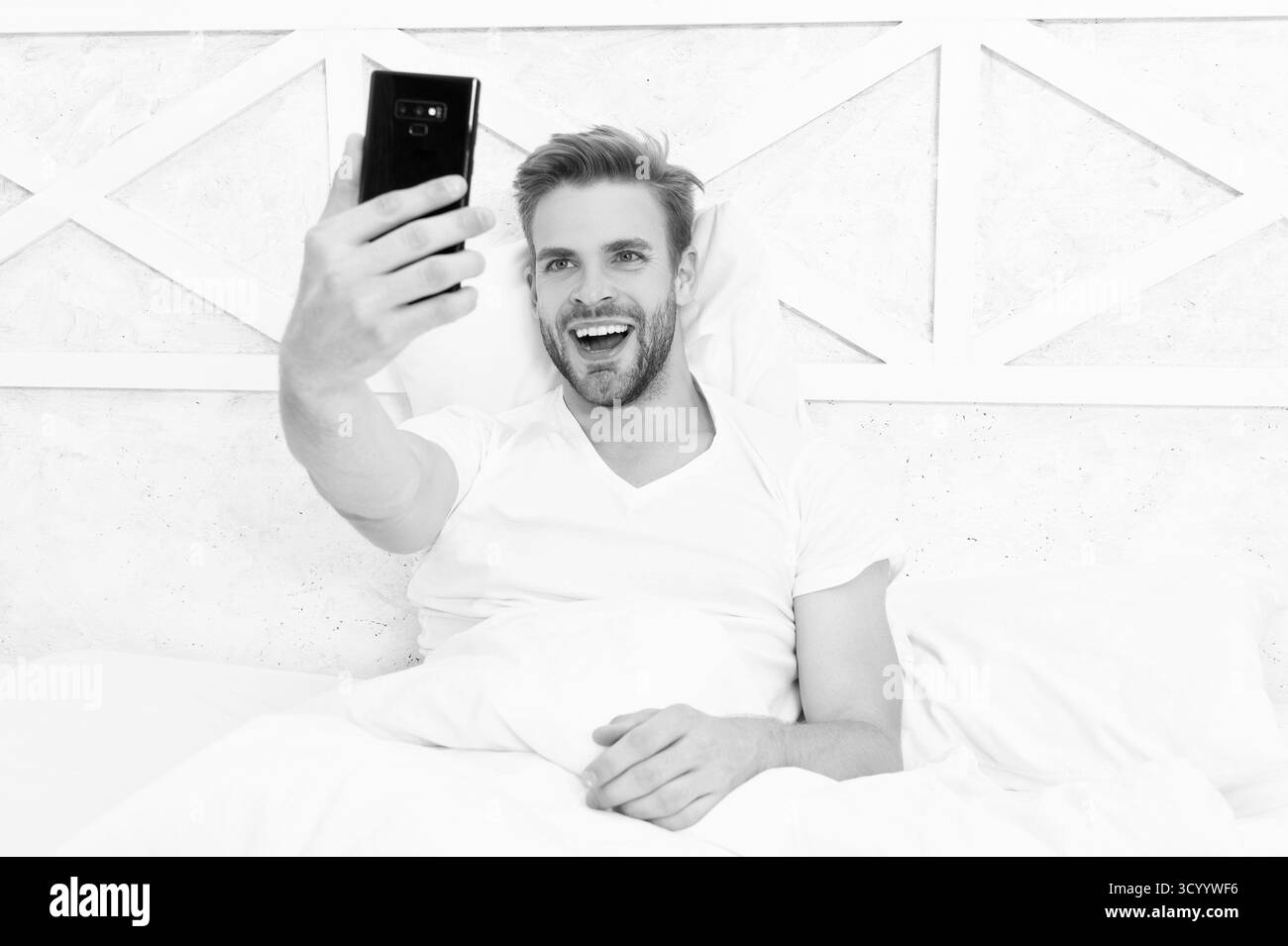 Millennial man using smartphone Black and White Stock Photos & Images ...