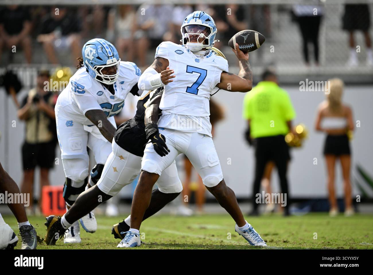 North Carolina quarterback Gio Lopez (7) is hit while throwing a pass ...