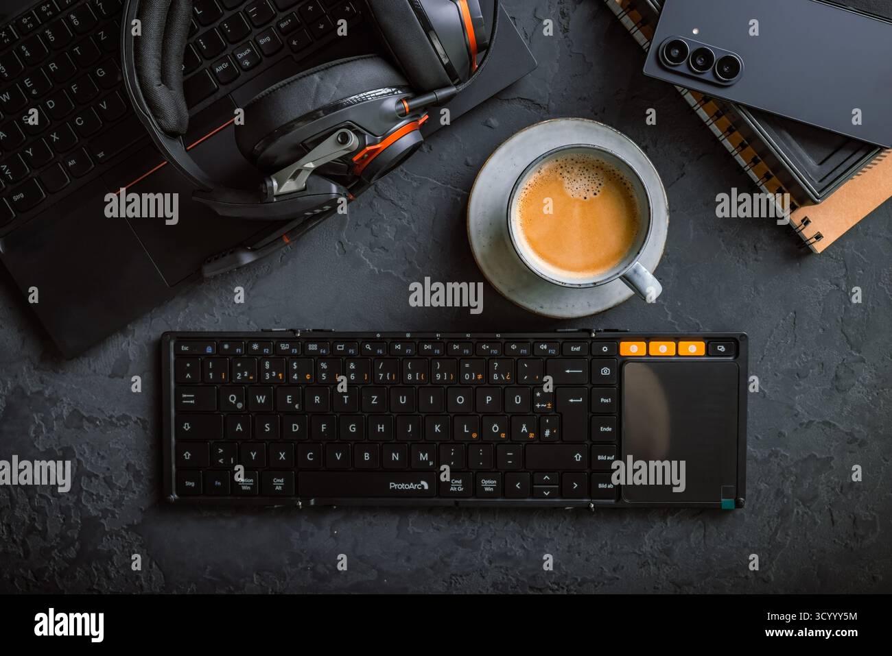 Office desk table with laptop computer, cup of coffee and supplies ...