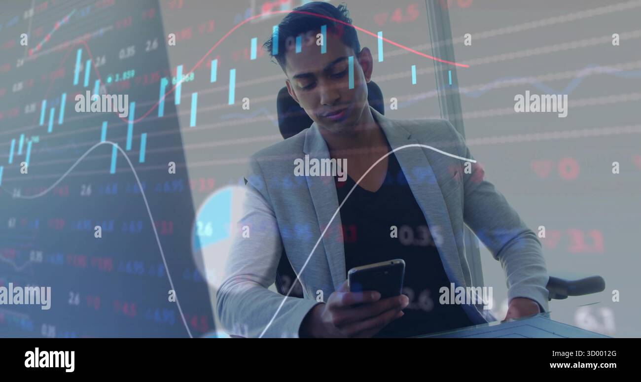 Monitoring smartphone, Indian analyst reviewing stock charts at office ...
